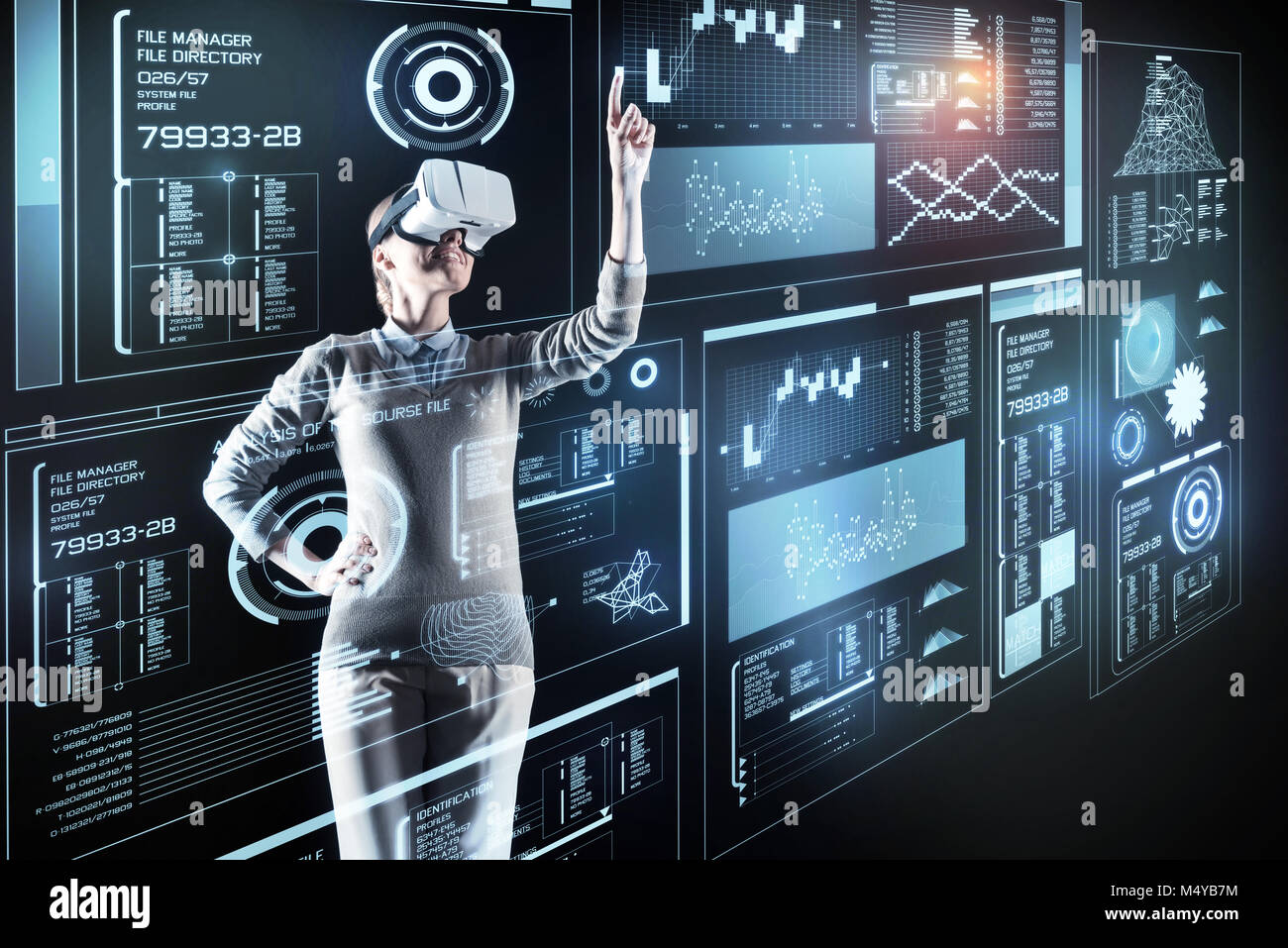 Young programmer in virtual reality glasses feeling happy while working Stock Photo - Alamy