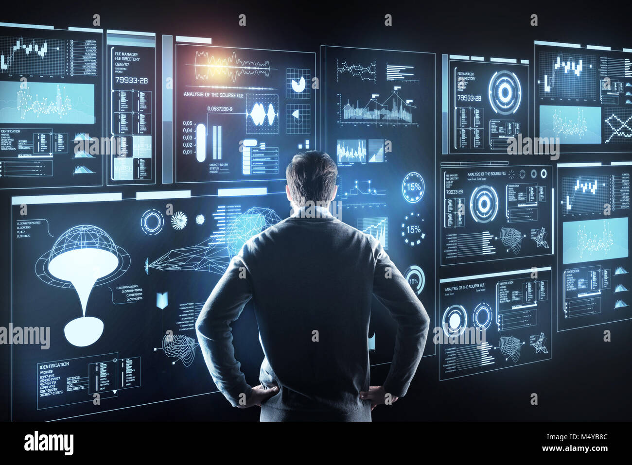 Smart man thinking while looking at the giant screen Stock Photo - Alamy