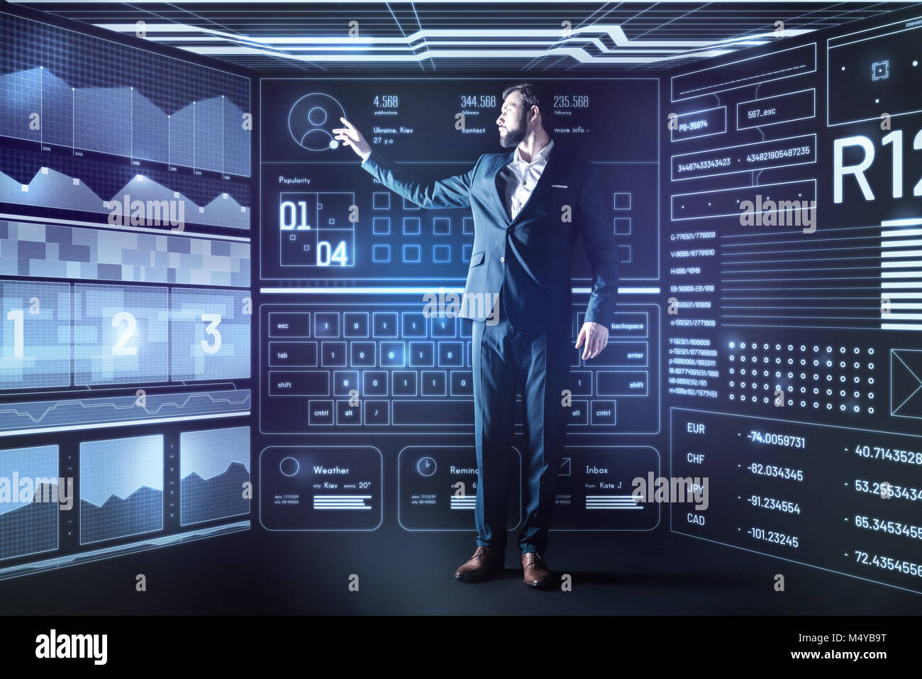 Elegant programmer touching the screen while changing personal ...