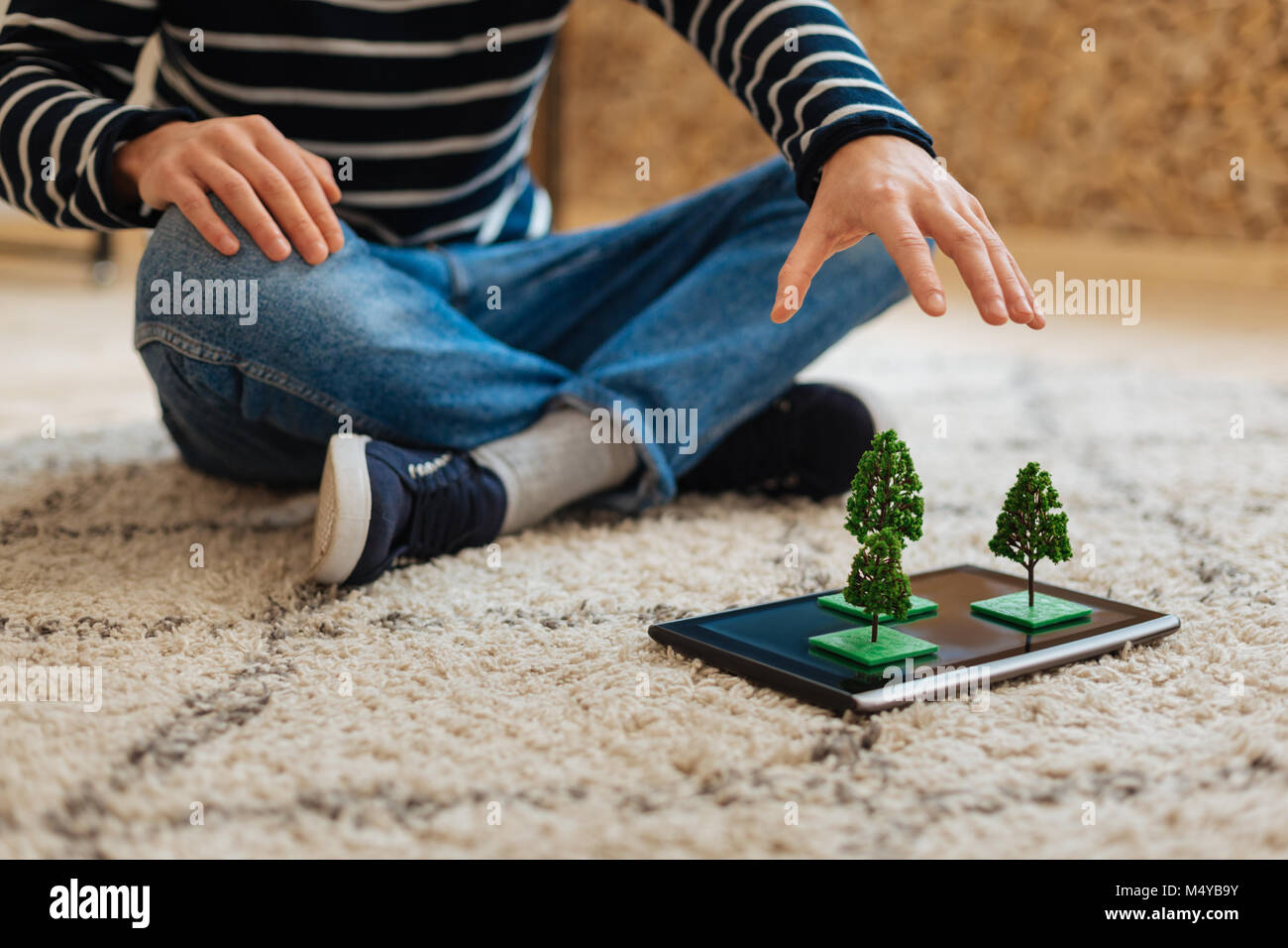 Student working on his ecological project at home Stock Photo - Alamy