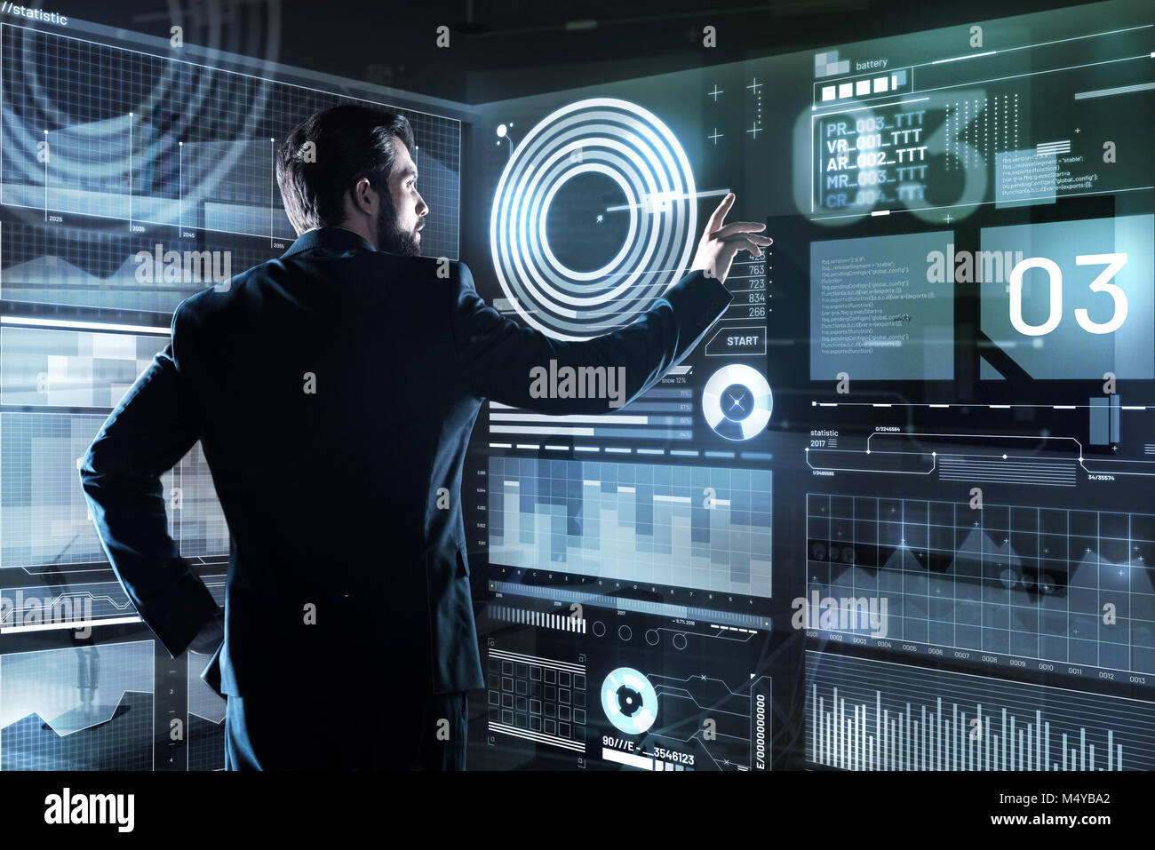 Smart programmer frowning and feeling worried while working Stock Photo ...