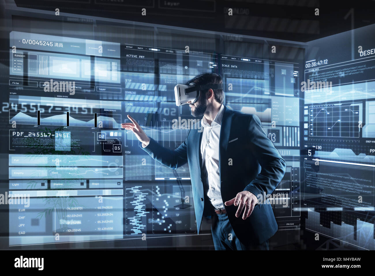 Futuristic man programmer wearing virtual hi-res stock photography and ...