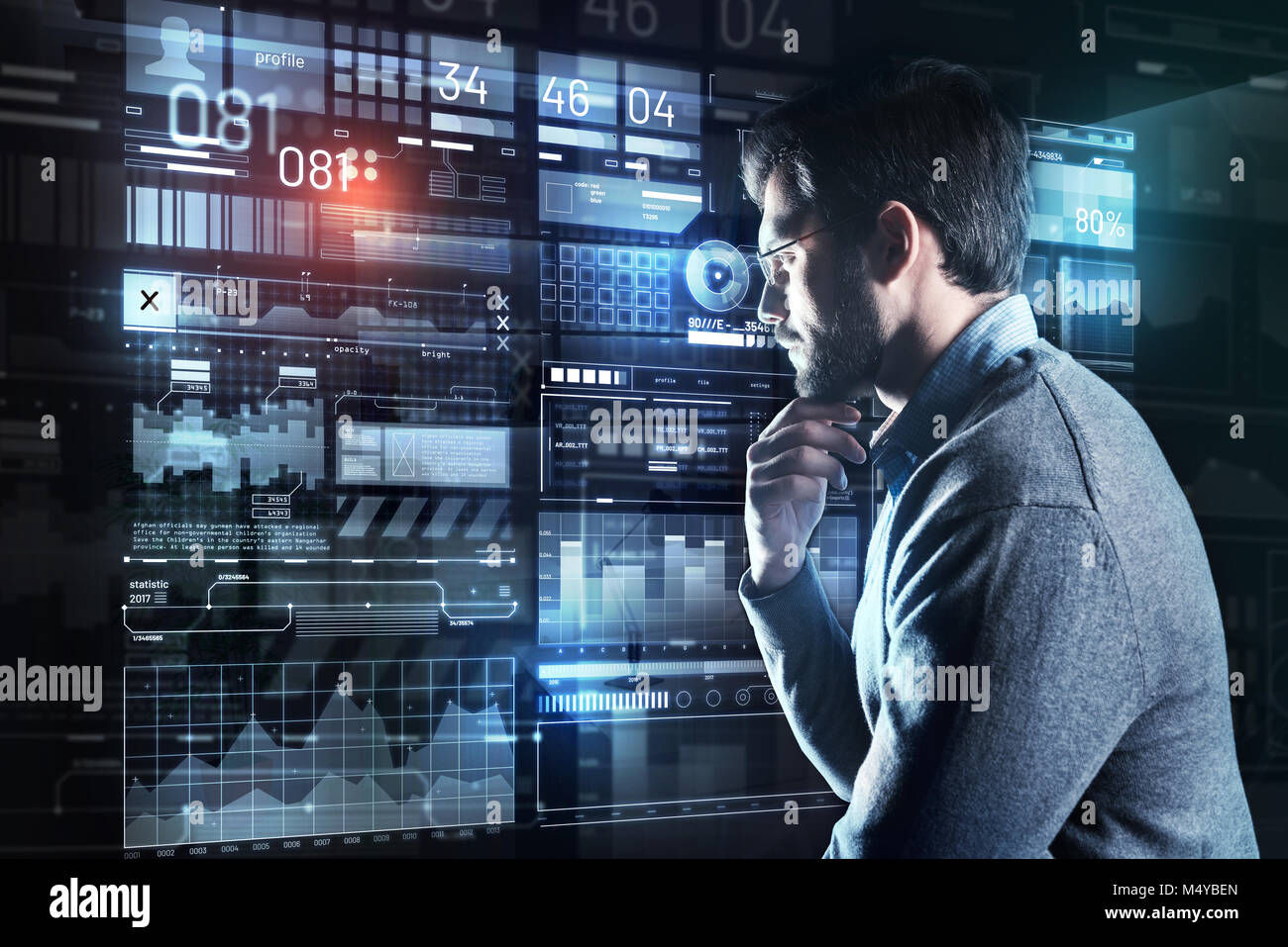 Responsible programmer leaning to the screen while thoughtfully looking ...