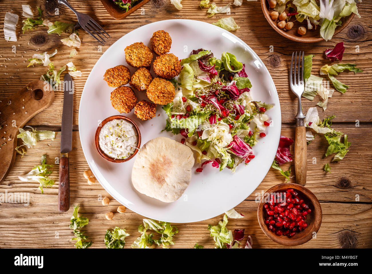Falafel, deep fried balls of ground chickpeas with tahini sauce and ...