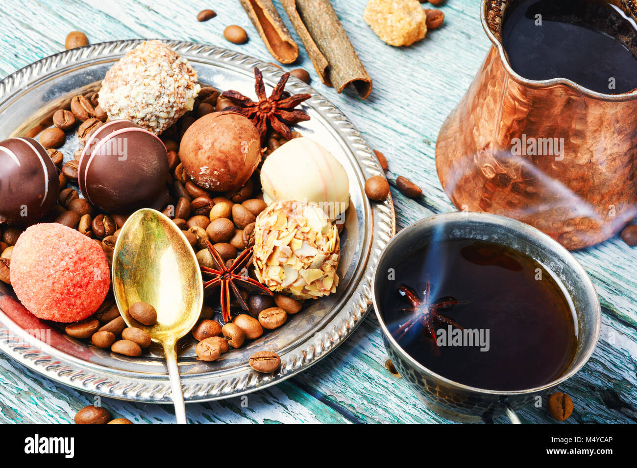 Delicious chocolate candies and fragrant black coffee Stock Photo - Alamy