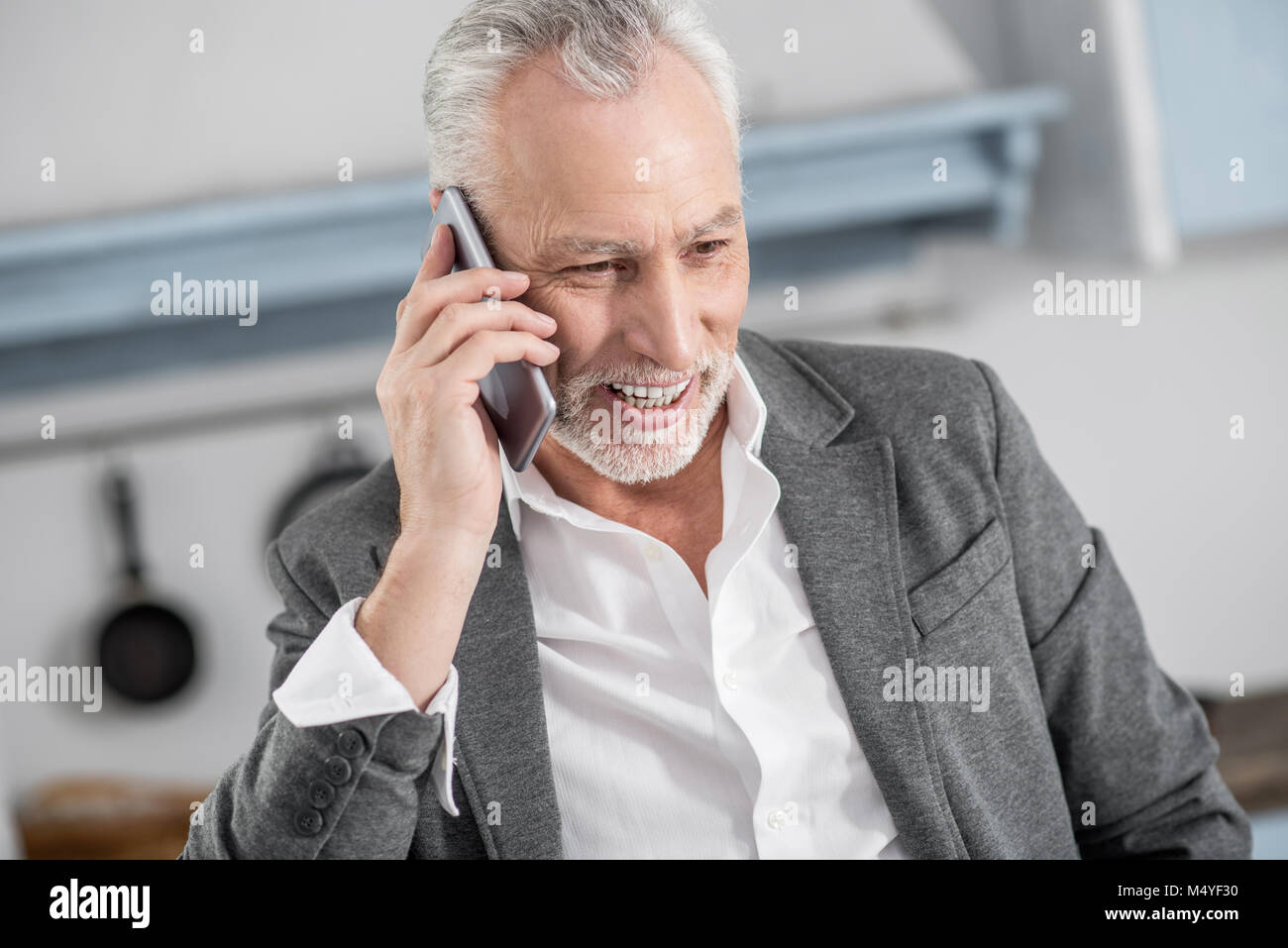 Successful male person talking per telephone Stock Photo - Alamy