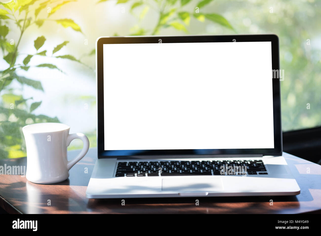 Laptop with blank screen on table. Workspace background new project on ...