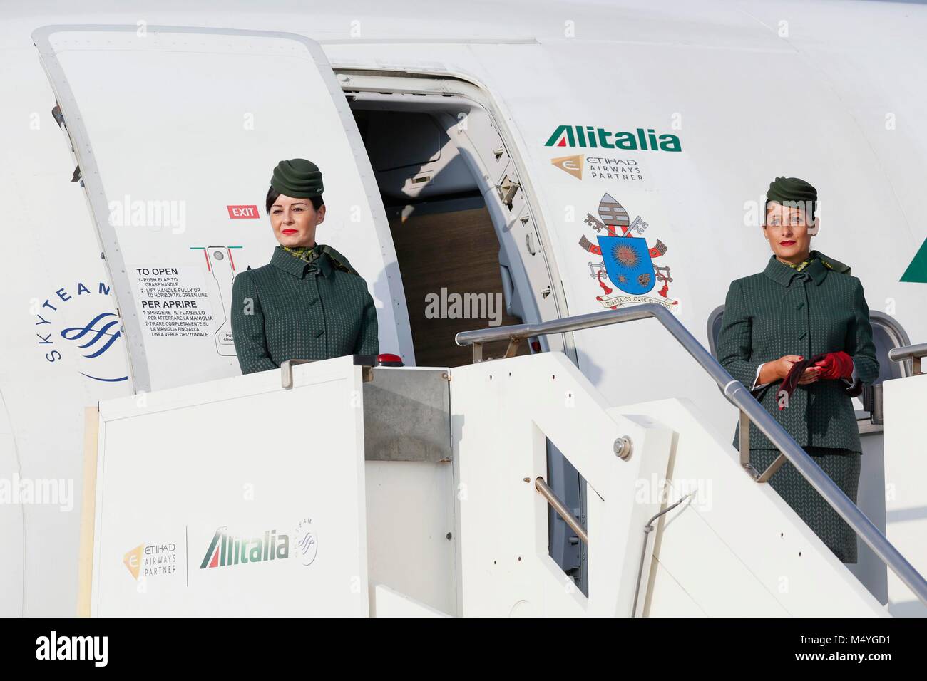 Alitalia plane departing, hostesses welcome passengers, Leonardo da ...