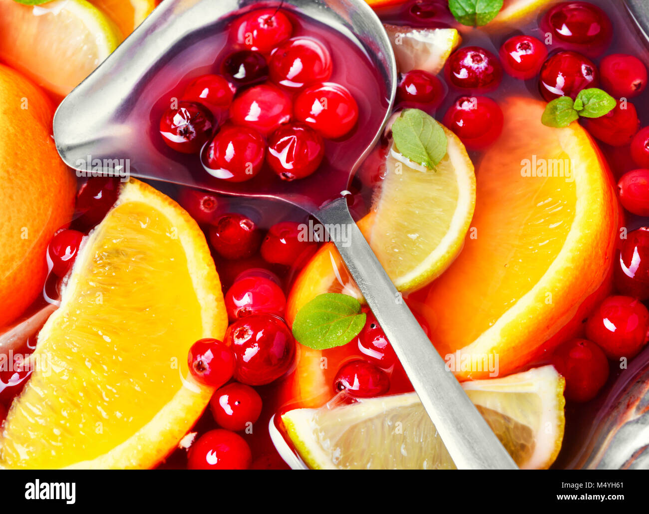 Alcoholic cocktail with pieces of fruit and berries.Sangria background ...