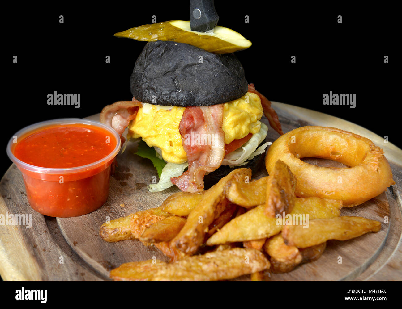 Homemade burger set serve on wooden plate photo with flash lighting ...