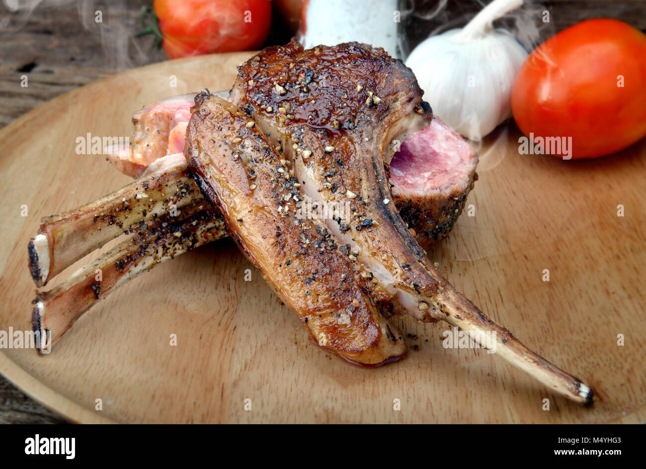 Grilled lamb ribs with hot and spicy pepper photo in studio lighting ...