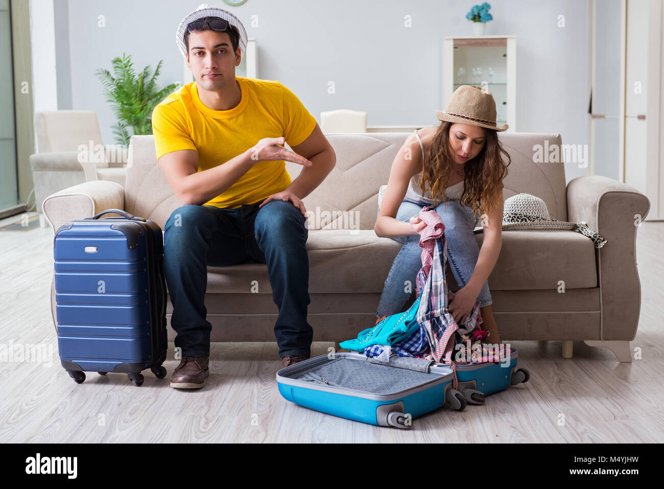 Young family preparing for travel vacation Stock Photo - Alamy