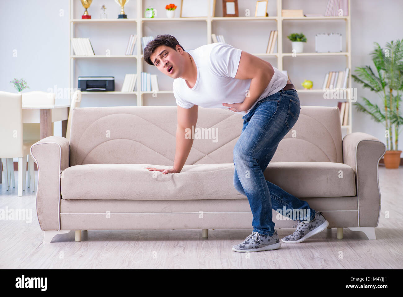 Man suffering from sick stomach and vomiting Stock Photo - Alamy