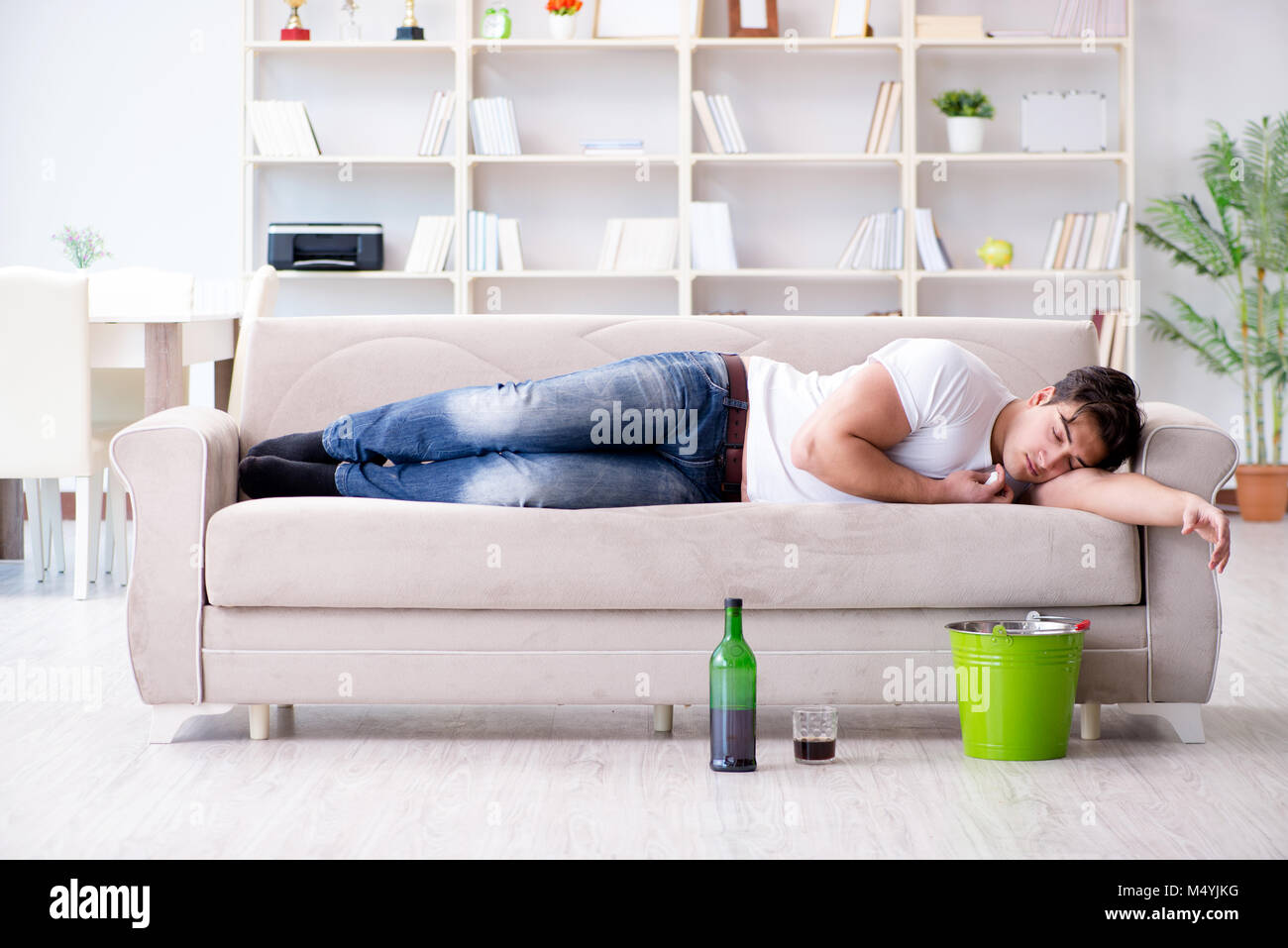 Man vomiting bucket hi-res stock photography and images - Alamy