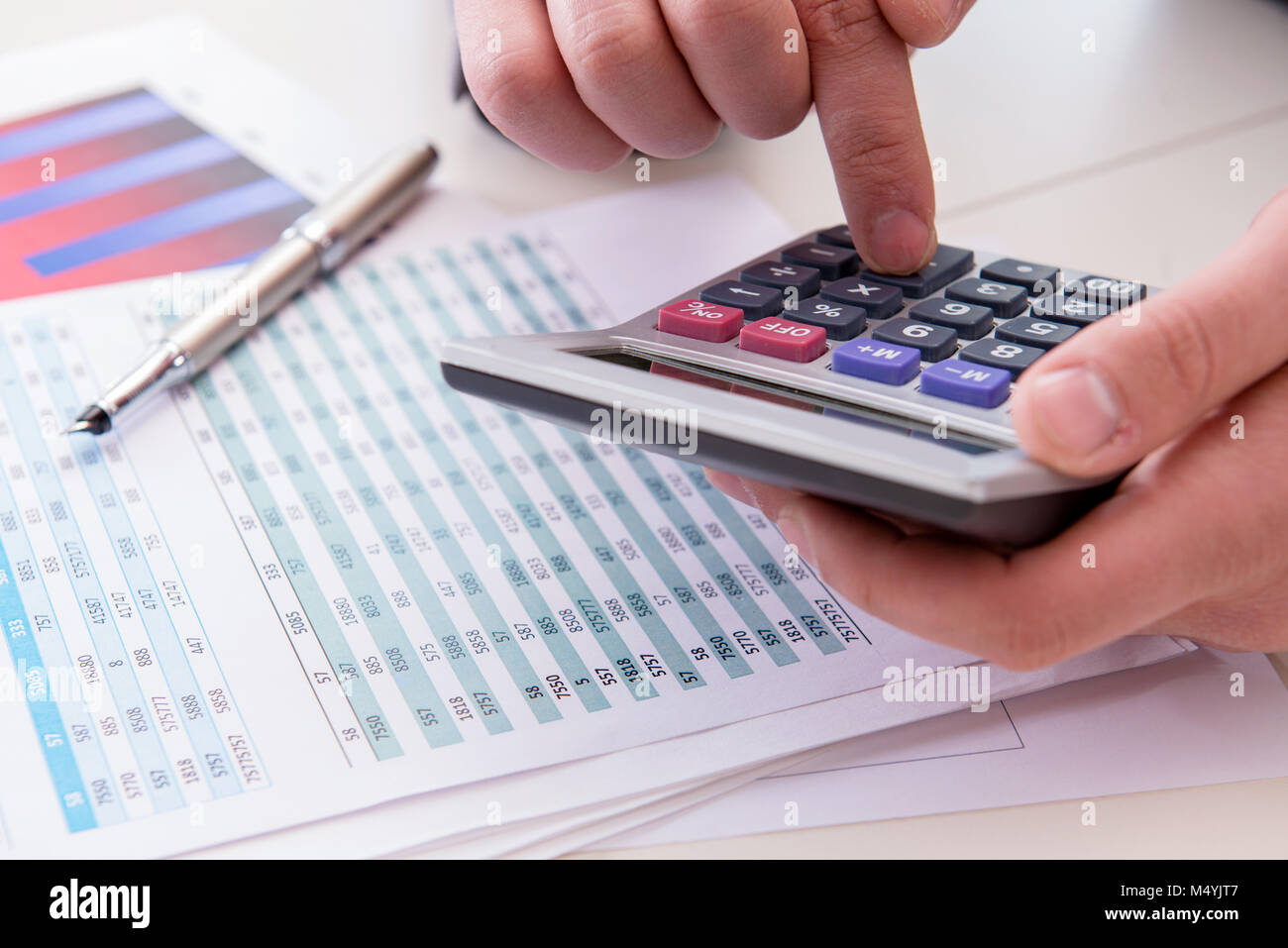 Finance analyst looking and financial reports Stock Photo - Alamy