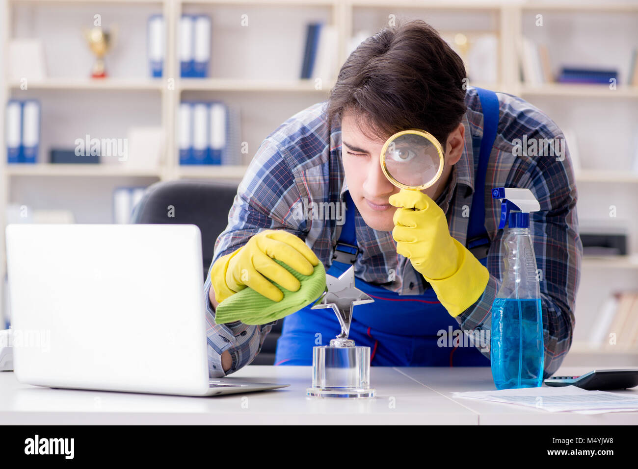 Male cleaner working in the office Stock Photo - Alamy