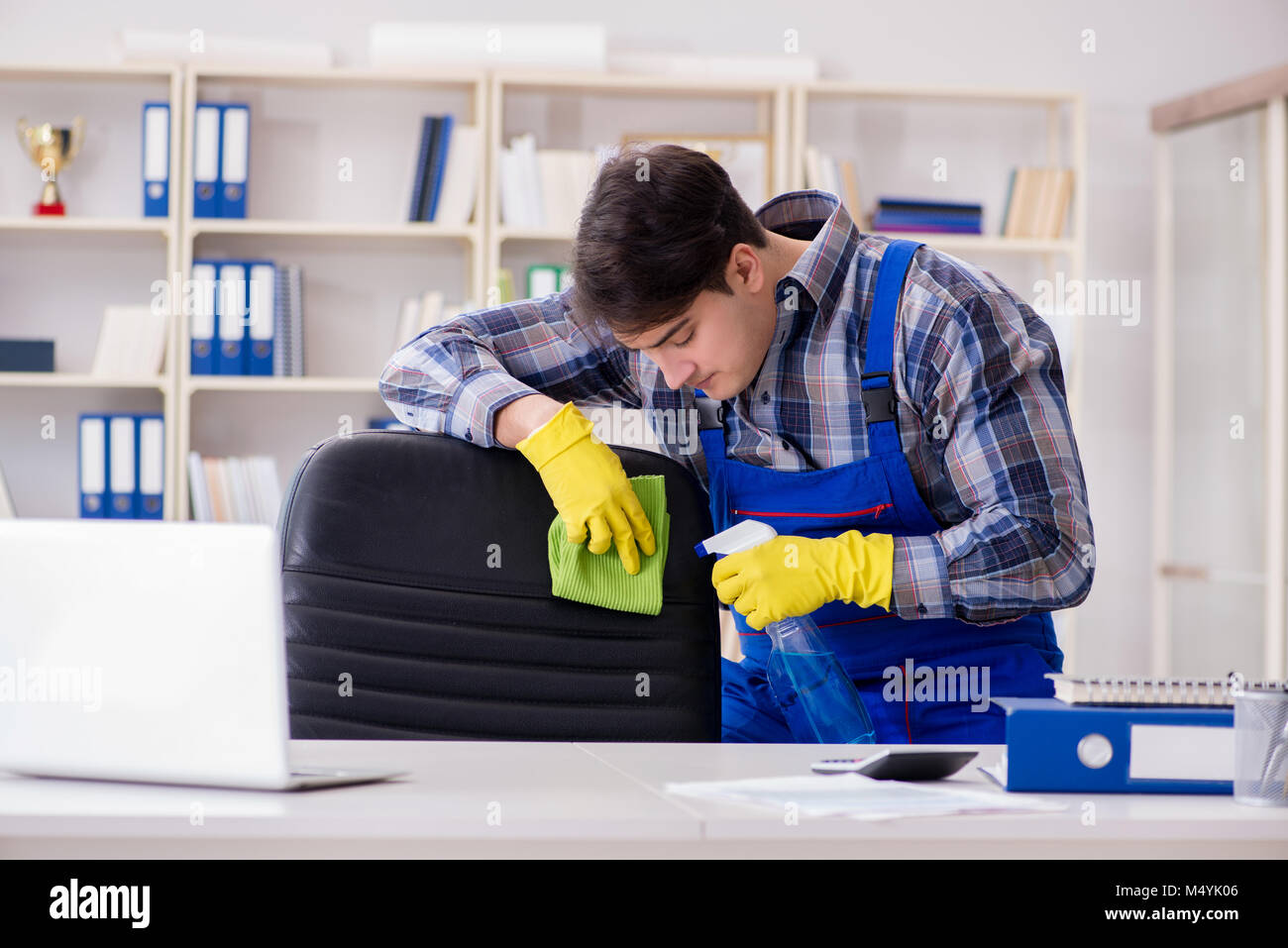 Male cleaner working in the office Stock Photo - Alamy