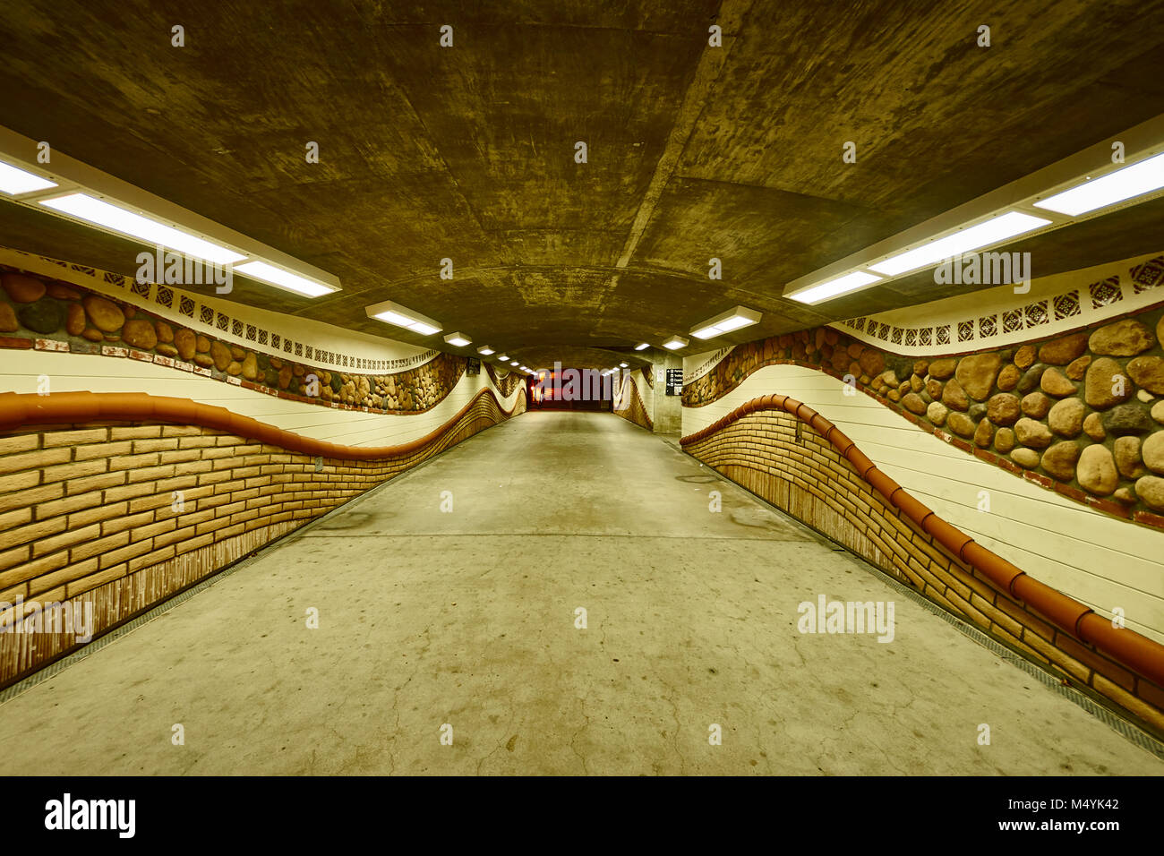 Images from an underground walkway decorated in a native american motif ...