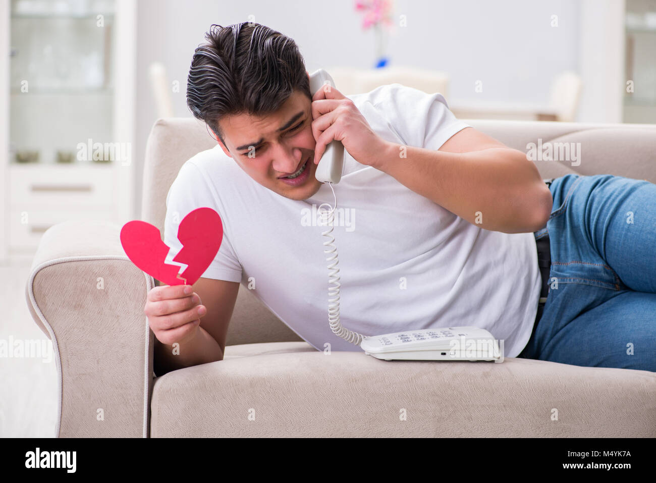 Young man in sad saint valentine concept Stock Photo - Alamy