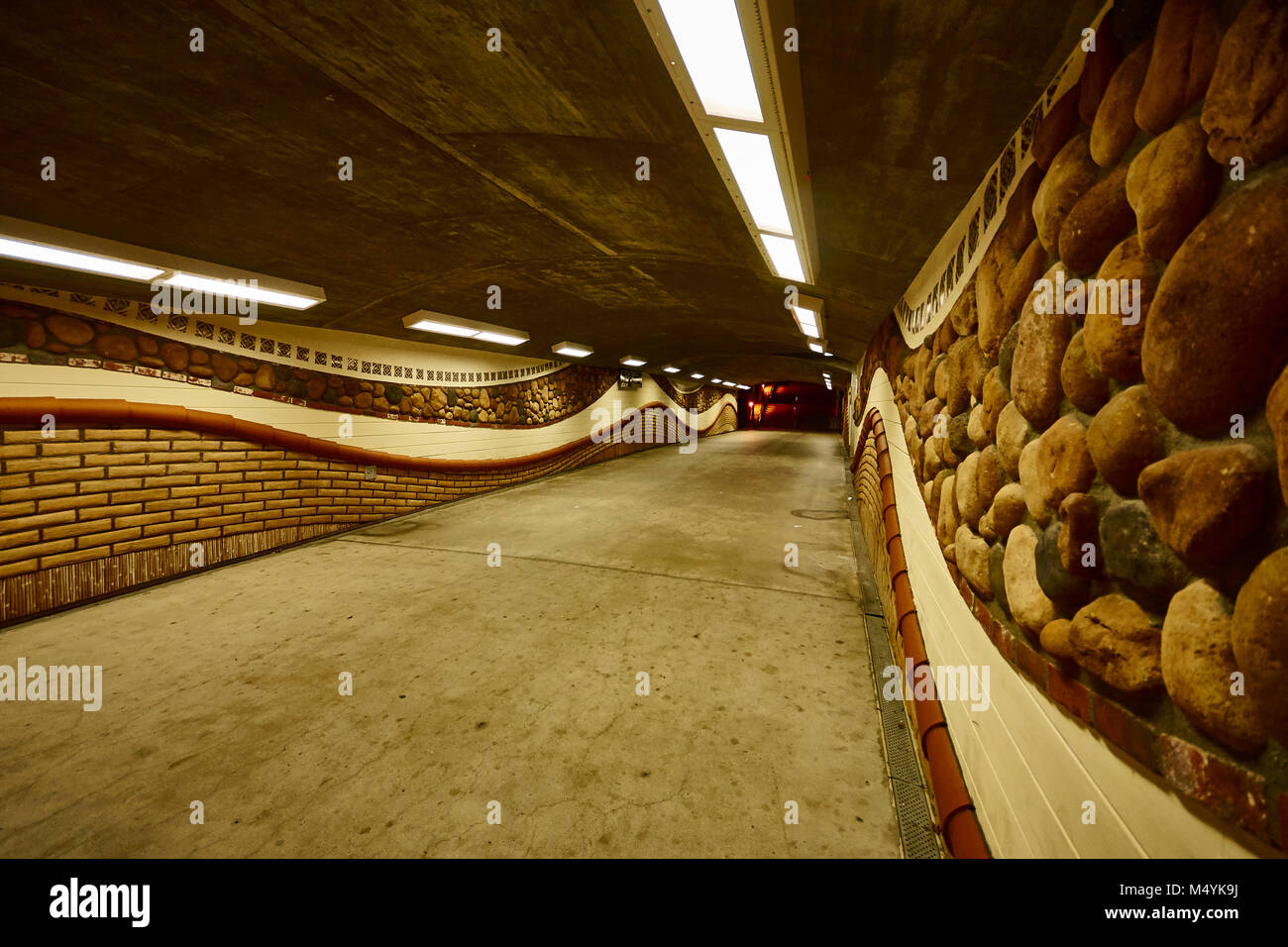 Images from an underground walkway decorated in a native american motif ...