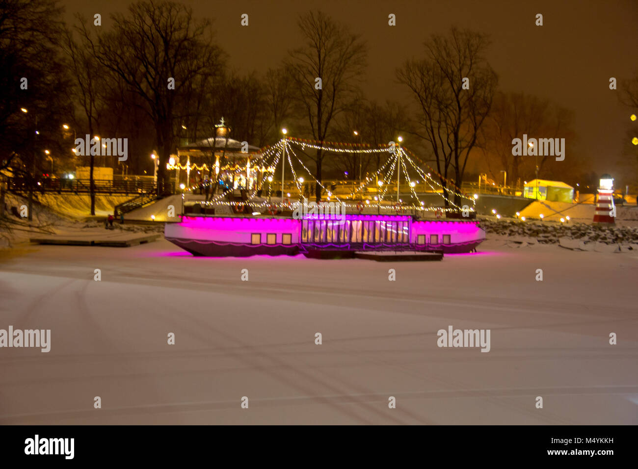Jelgava Pasta island in winter nignht cafe ship and Holy Trinity Church ...
