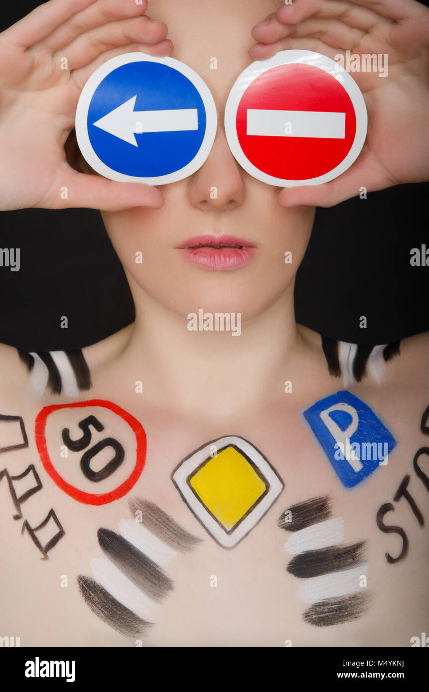 Portrait of beautiful woman with traffic signs Stock Photo - Alamy