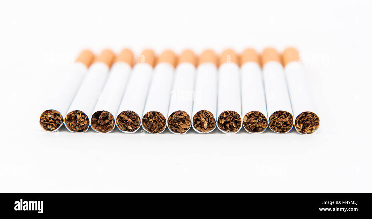 Stack of cigarette on the white background with partial focus Stock ...