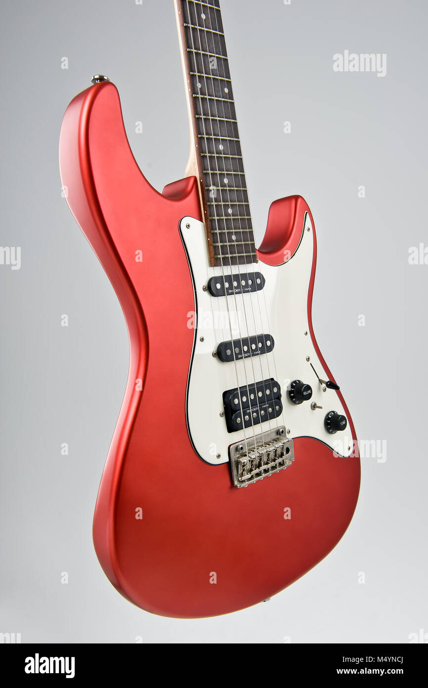 Red electric guitar on Grey background Stock Photo - Alamy
