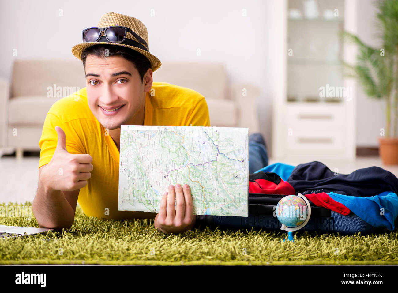 Man planning his vacation trip with map Stock Photo - Alamy