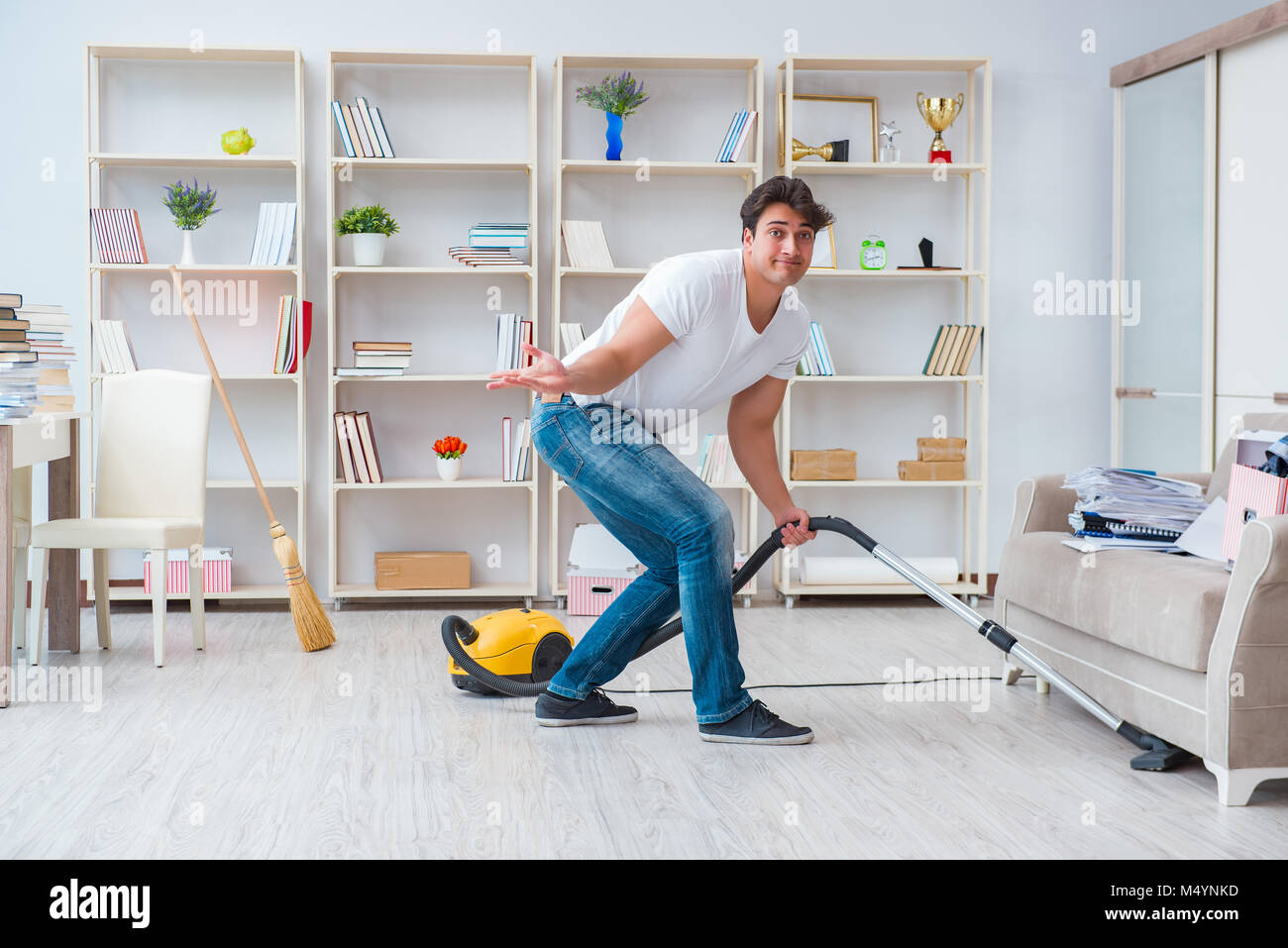 Man doing cleaning at home Stock Photo - Alamy