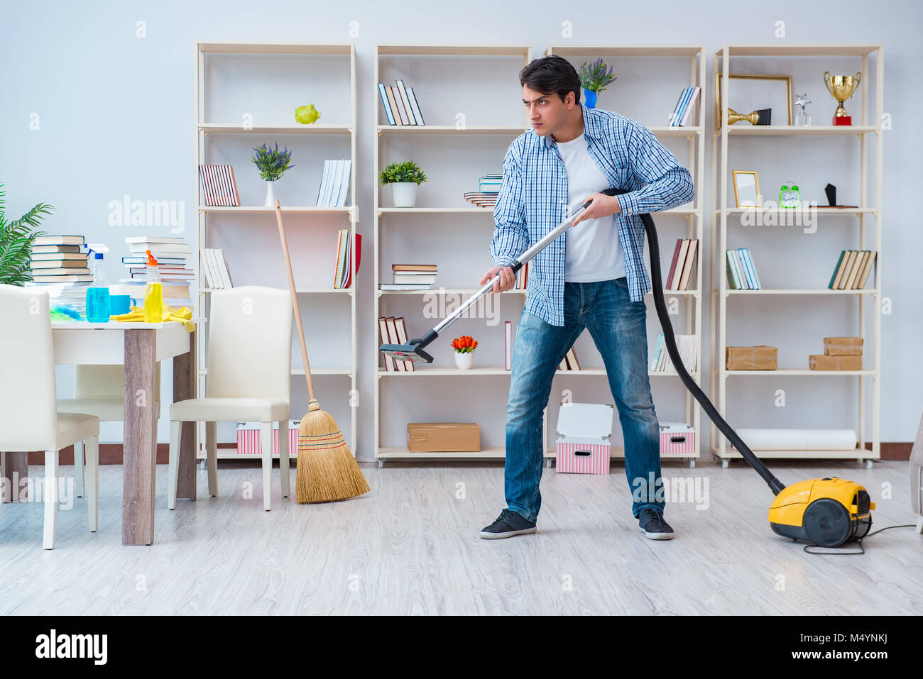 Man doing cleaning at home Stock Photo - Alamy