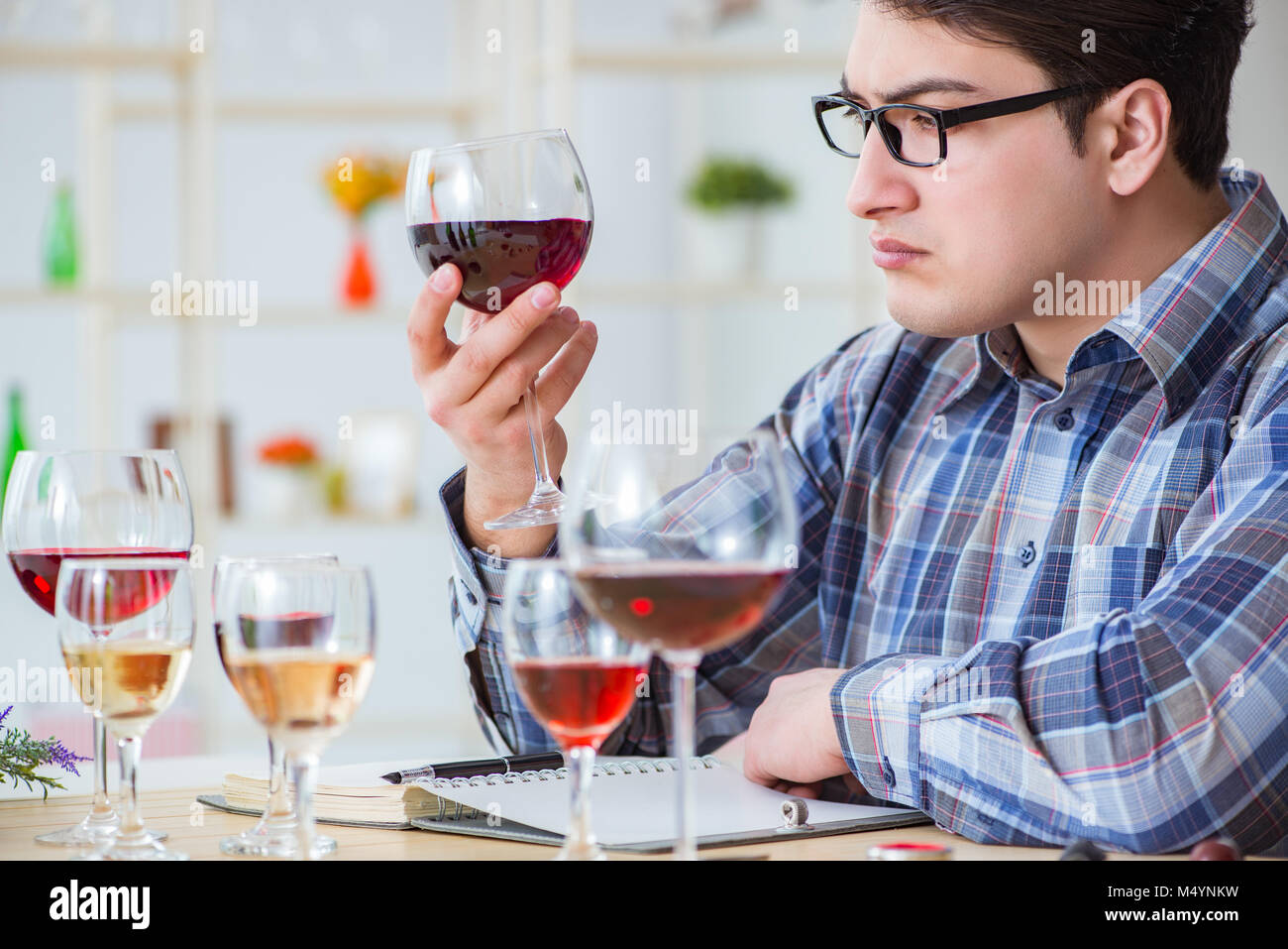 Professional sommelier tasting red wine Stock Photo - Alamy