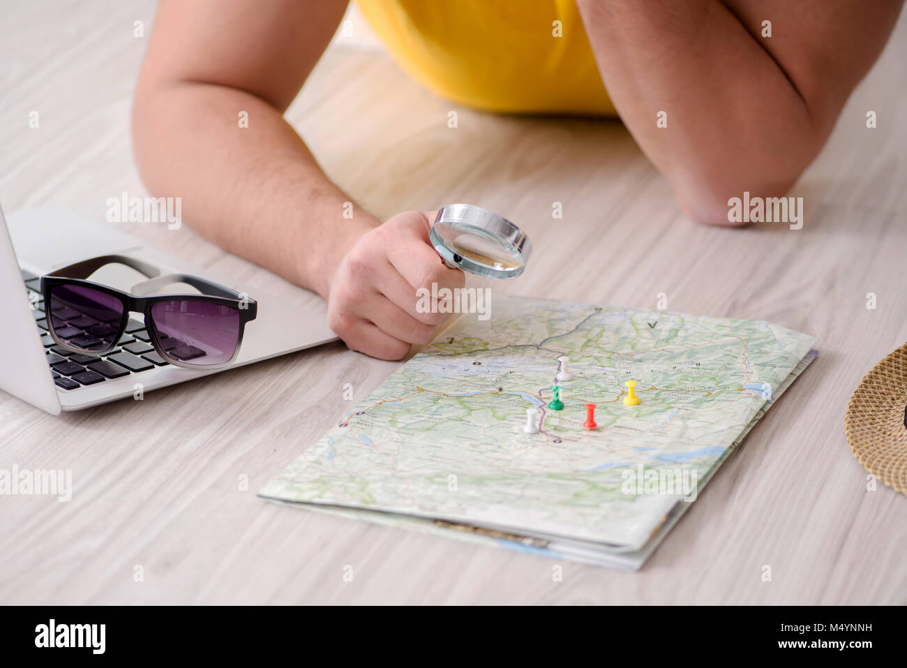 Man planning his vacation trip with map Stock Photo - Alamy