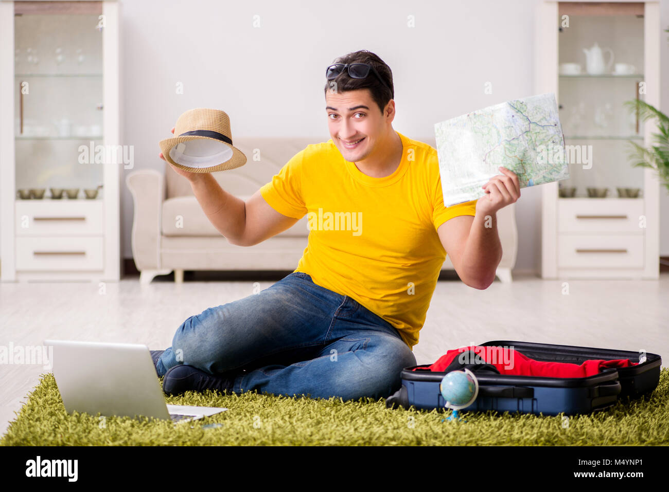 Man planning his vacation trip with map Stock Photo - Alamy
