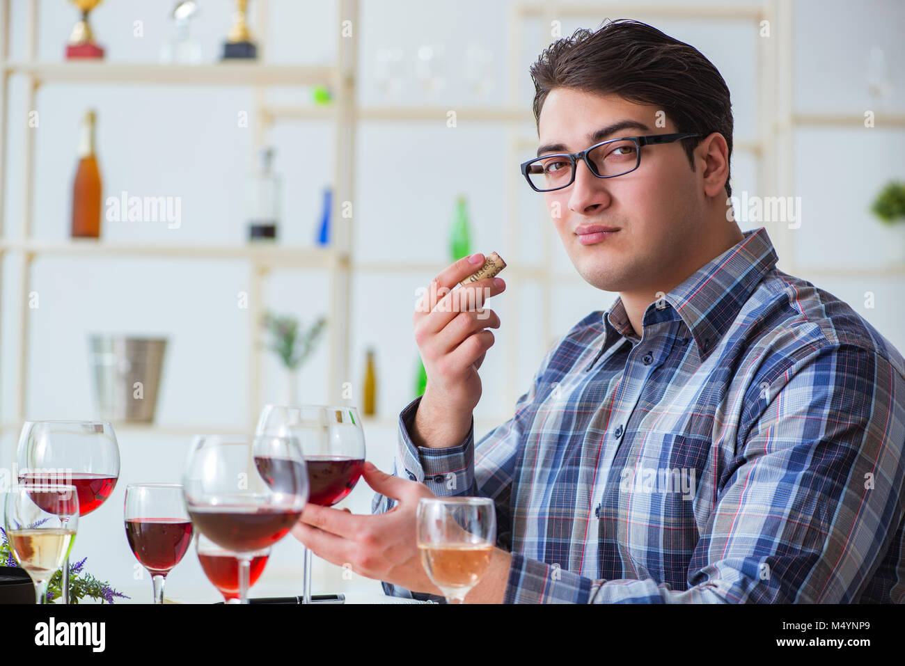 Professional sommelier tasting red wine Stock Photo - Alamy