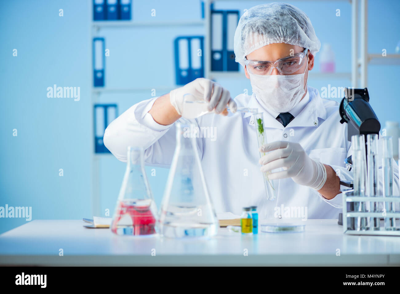 Biotechnology concept with scientist in lab Stock Photo - Alamy