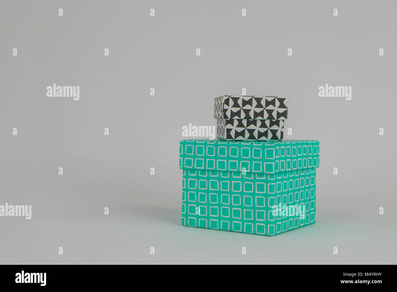 A small black-and-white box with a big turquoise box Stock Photo - Alamy