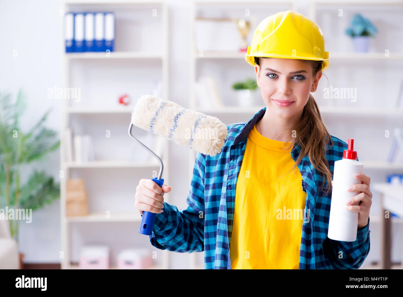 Young woman doing painting at home Stock Photo - Alamy