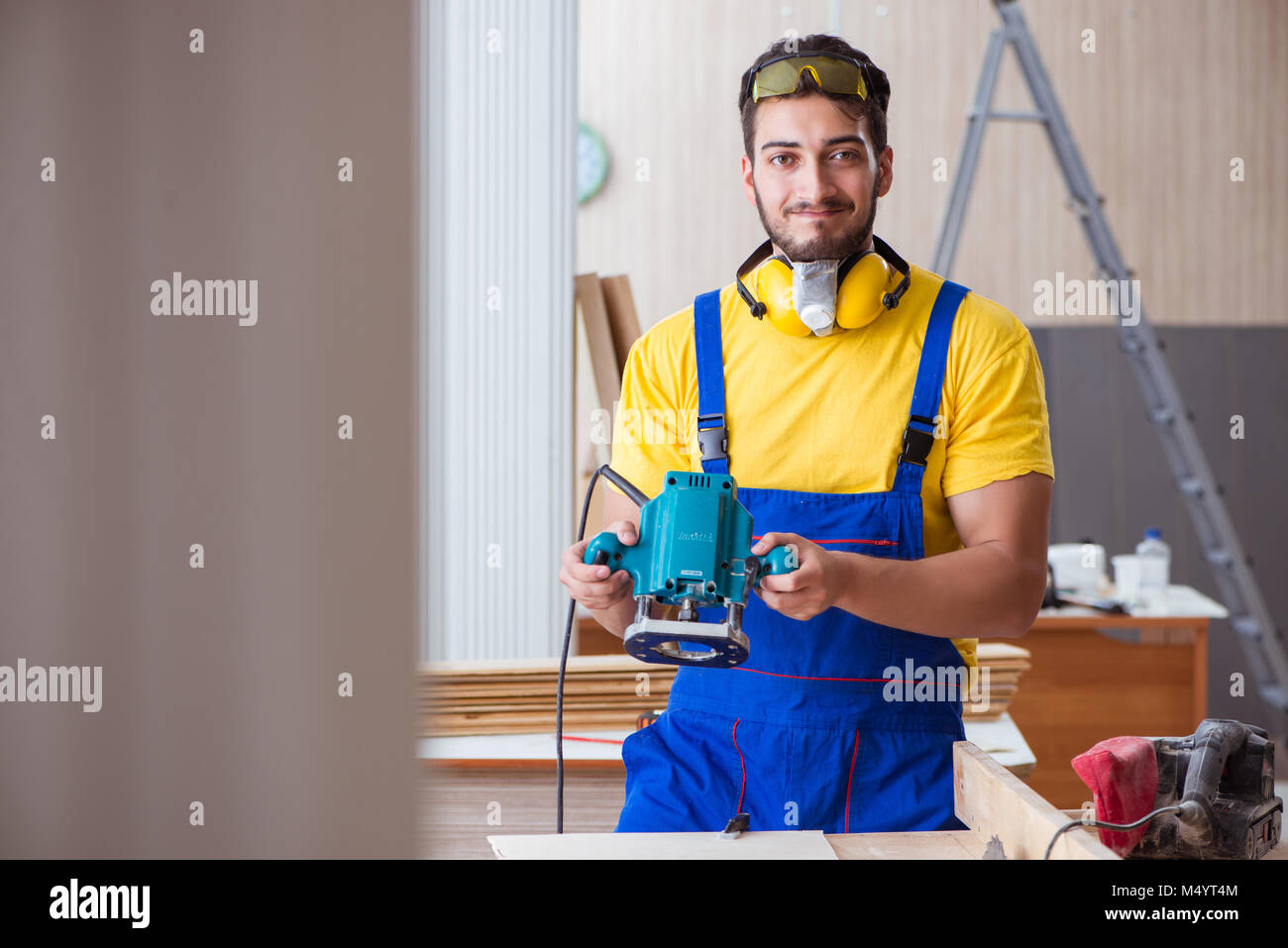 Carpenter working in the workshop Stock Photo - Alamy