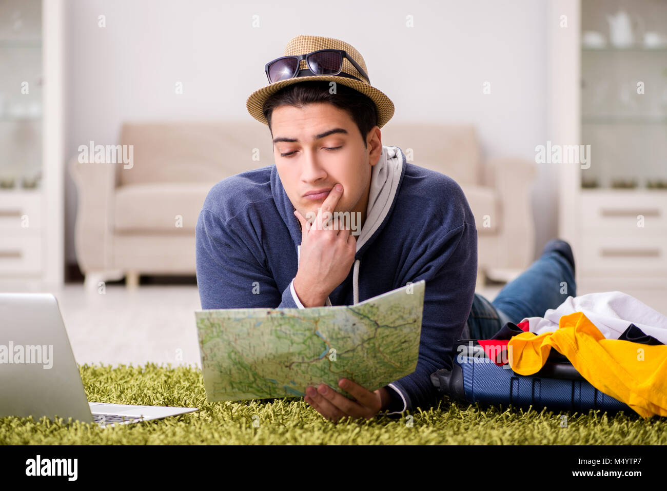 Man planning his vacation trip with map Stock Photo - Alamy