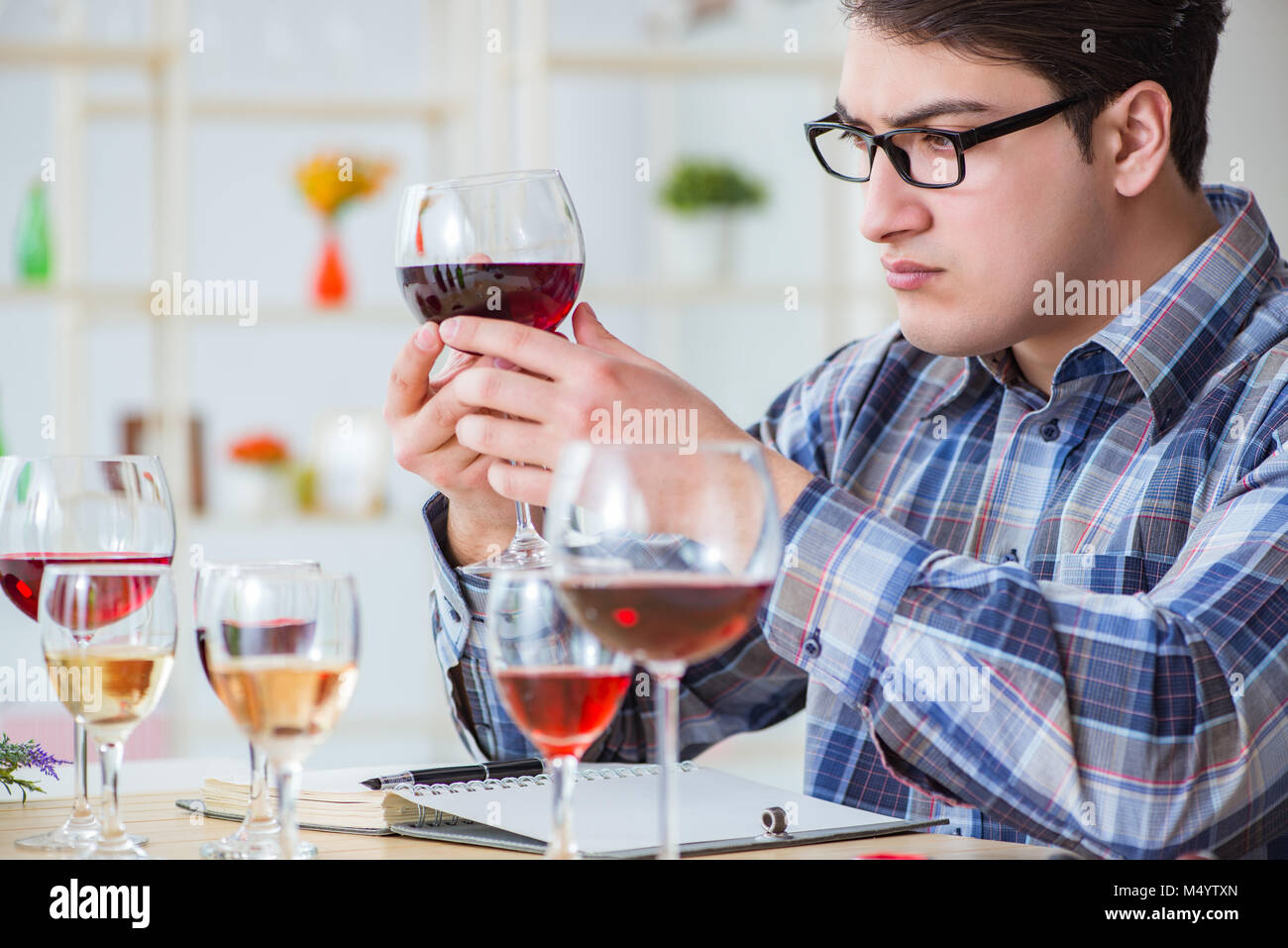 Professional sommelier tasting red wine Stock Photo - Alamy