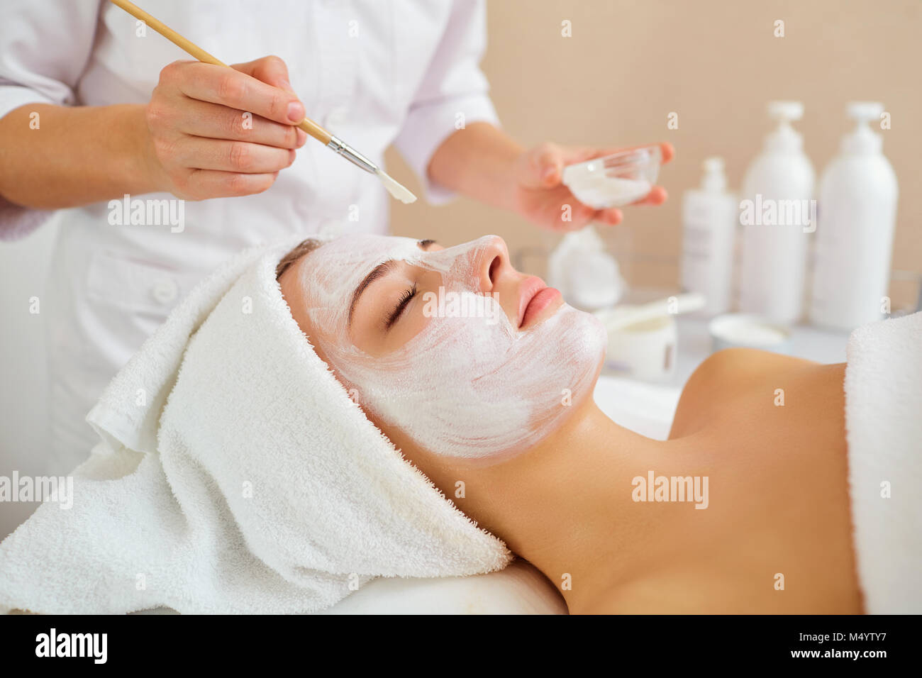 Woman in mask on face in spa beauty salon Stock Photo - Alamy