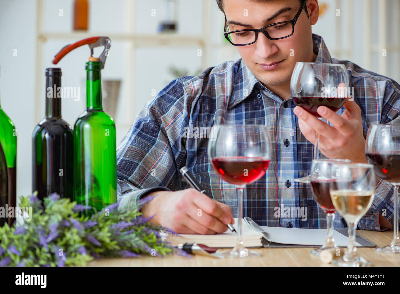 Professional sommelier tasting red wine Stock Photo - Alamy