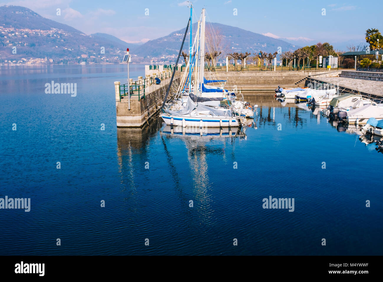 port with sailboats with background the lake and mountains on a bright ...