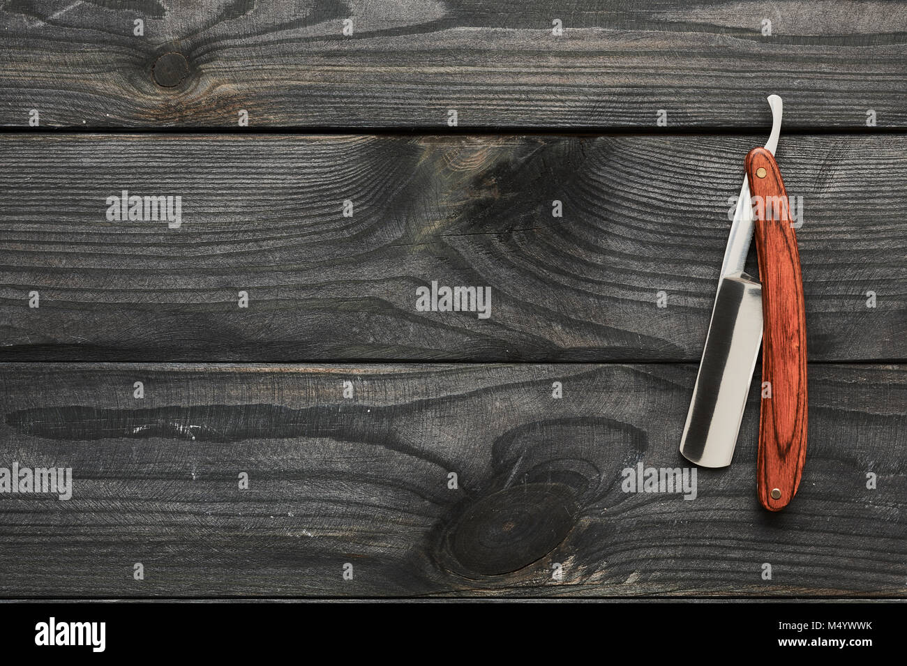 Vintage barber shop straight razor tool on wooden background Stock ...