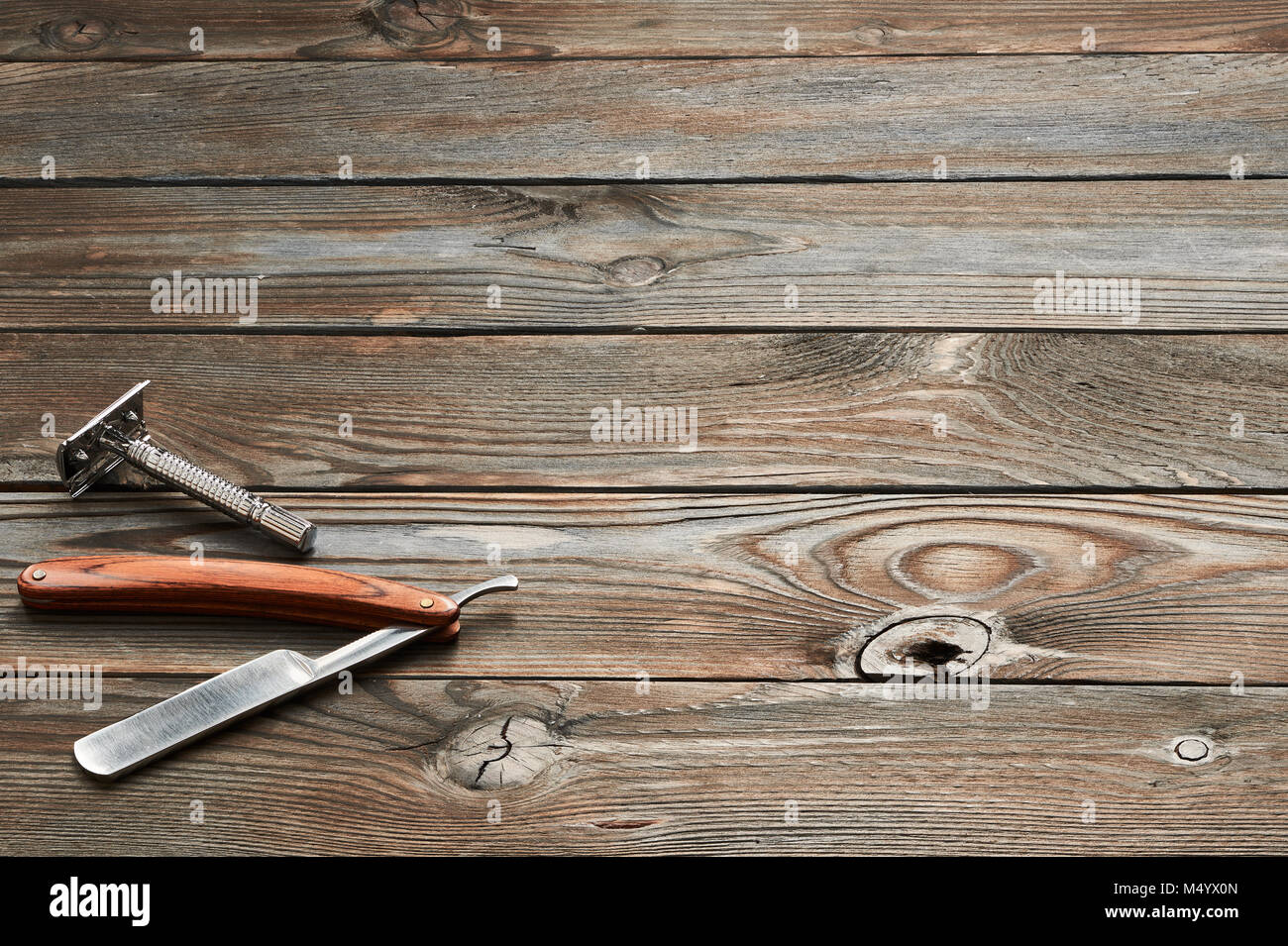 Vintage barber shop razor tools on wooden background Stock Photo - Alamy