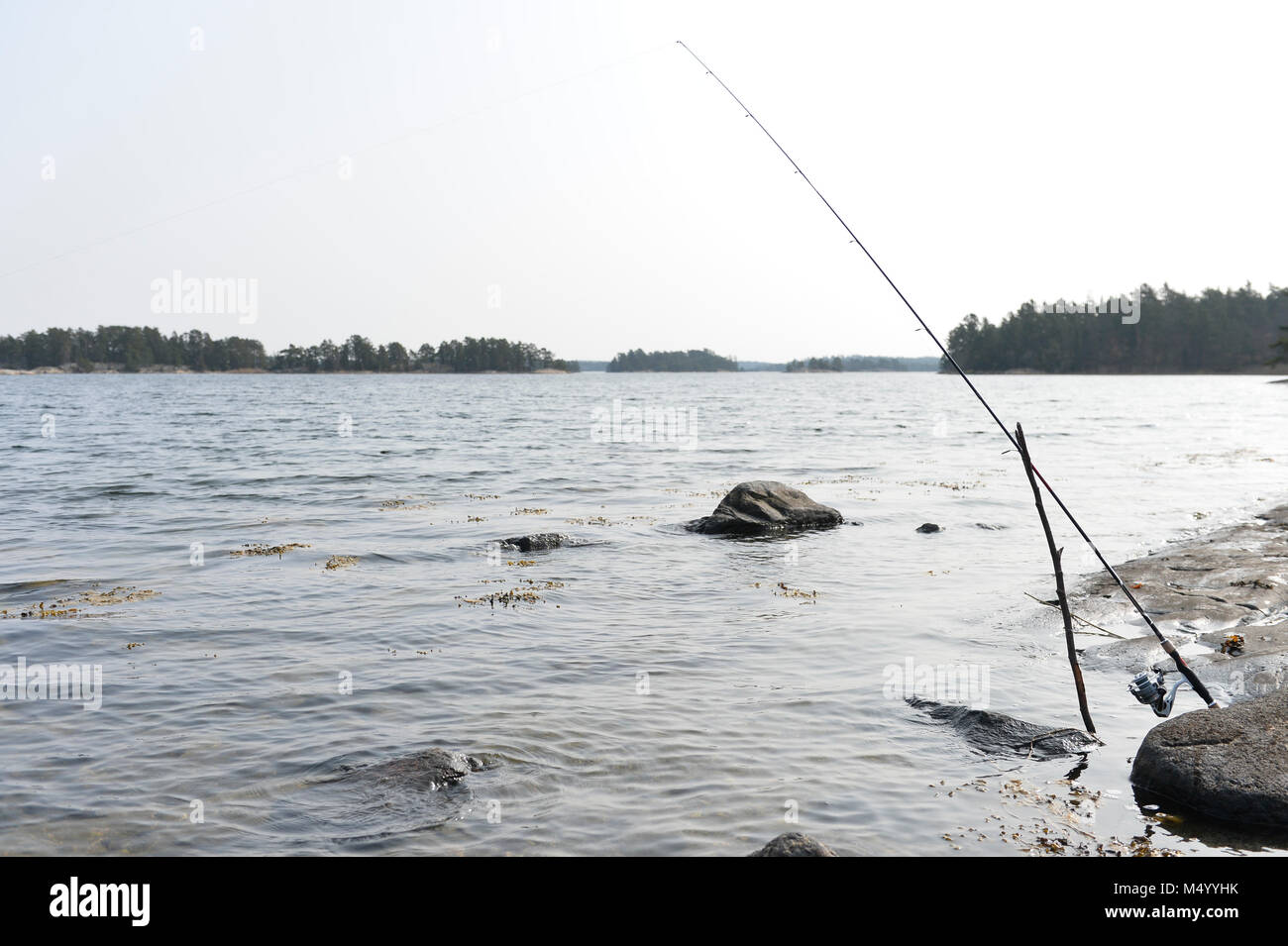 Fishing rod spinning in hi-res stock photography and images - Alamy