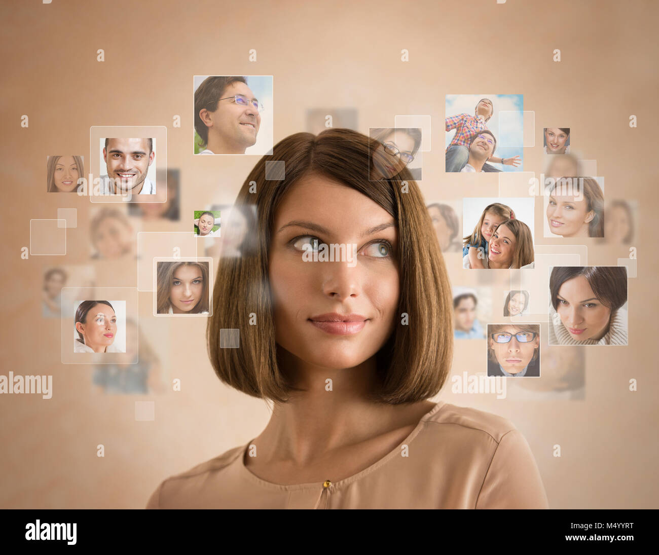 Young woman standing and smiling with many different people's faces ...