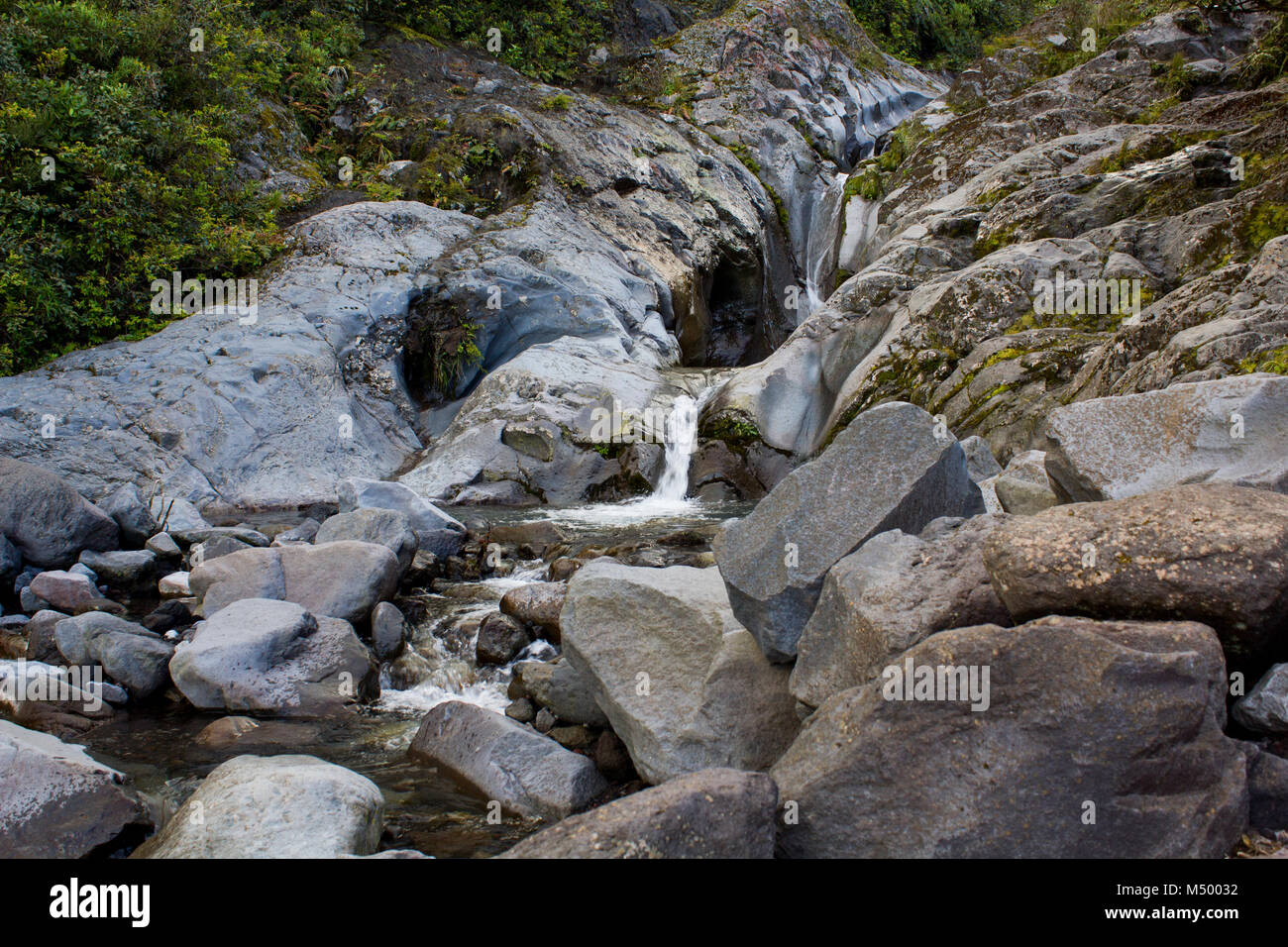 Cascade falls over rocks Stock Photo - Alamy