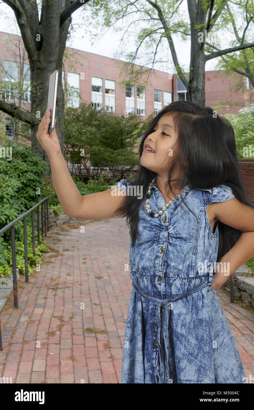Little Girl Using Cell Phone Stock Photo - Alamy